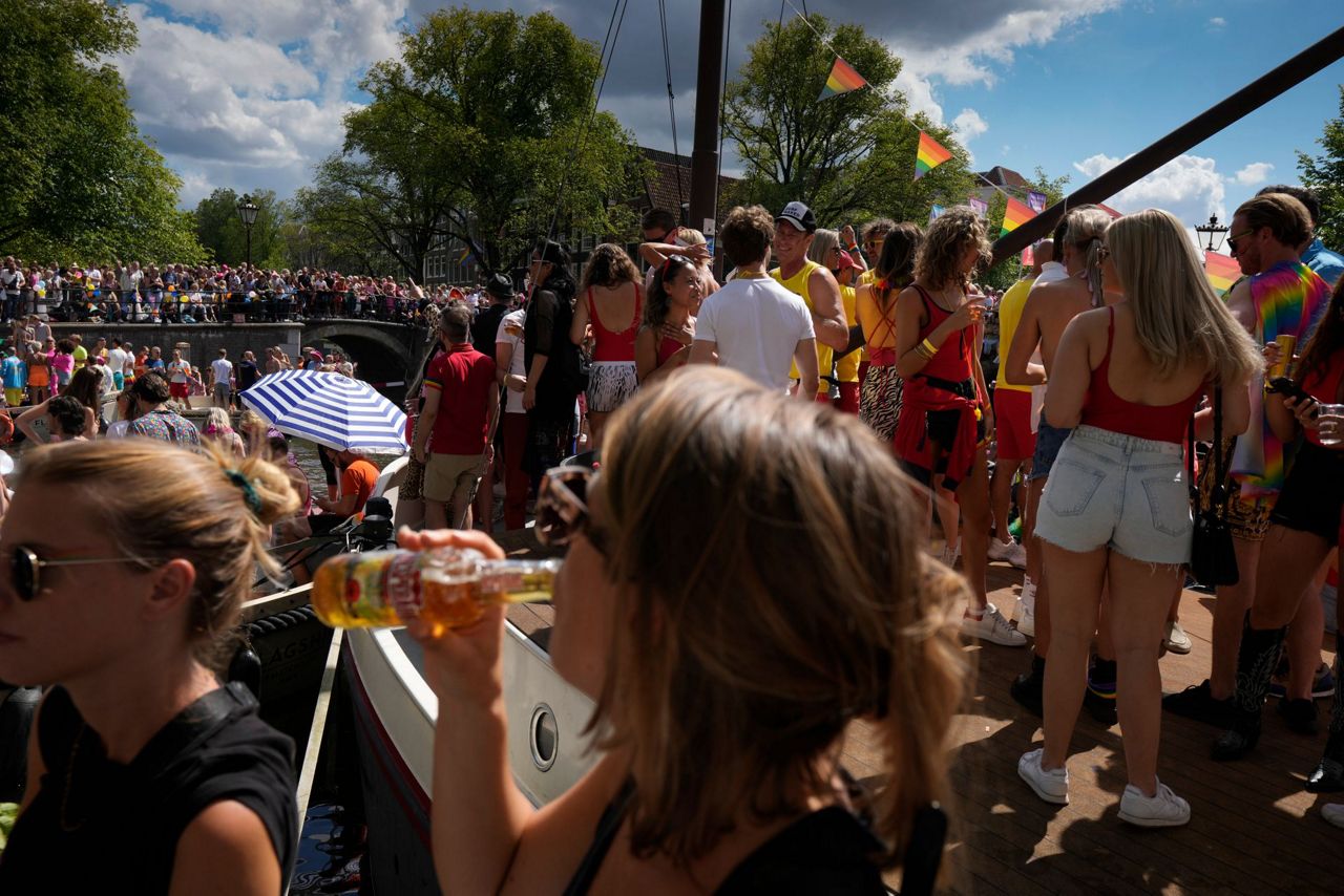 Huge crowds watch Amsterdam Pride's canal parade celebration