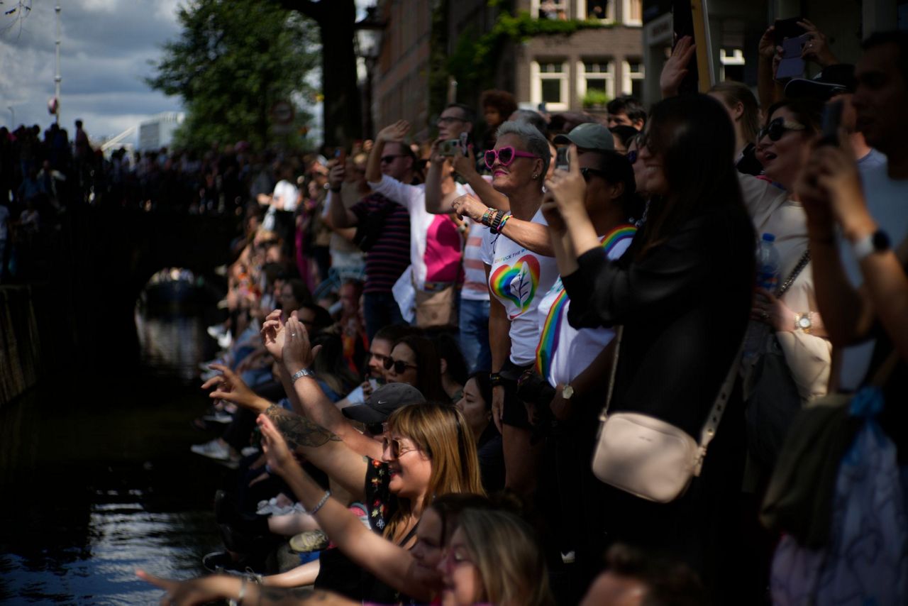Huge crowds watch Amsterdam Pride's canal parade celebration