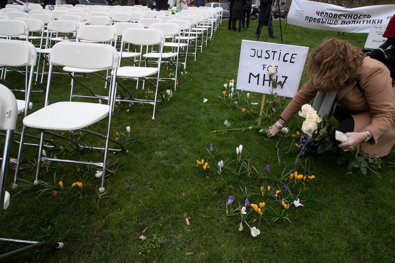 MH17 relatives protest Russian actions with 298 empty chairs