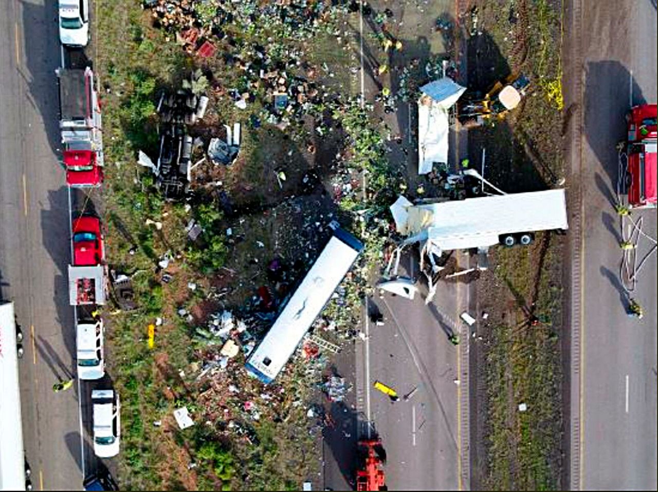 US agency examines front tires of semi-trailer that hit bus