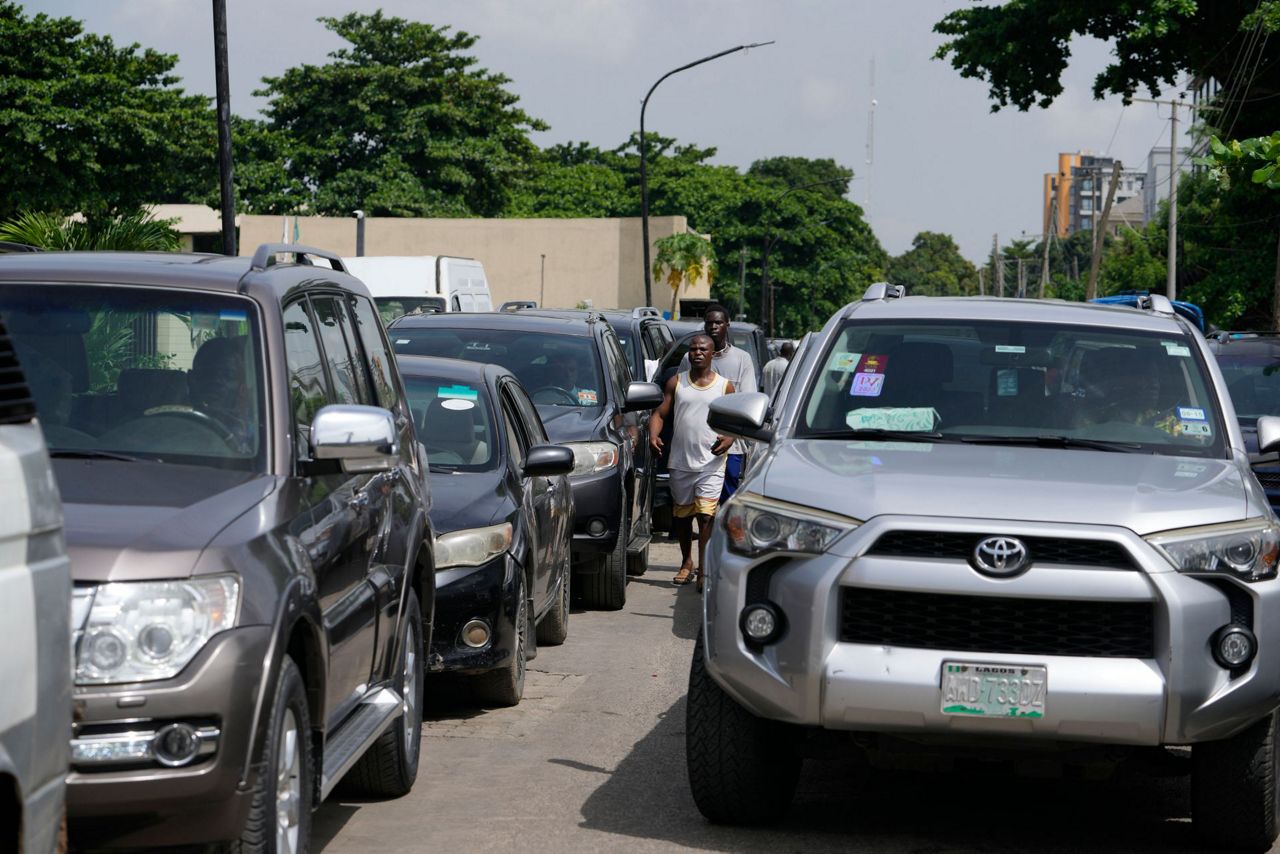 Drivers line up for gasoline across Nigeria after new president scraps fuel subsidy
