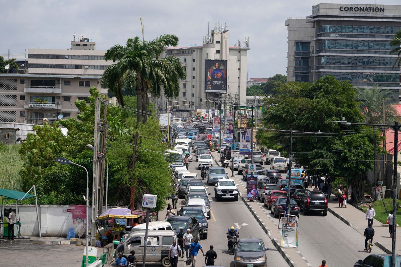 Drivers line up for gasoline across Nigeria after new president scraps fuel subsidy