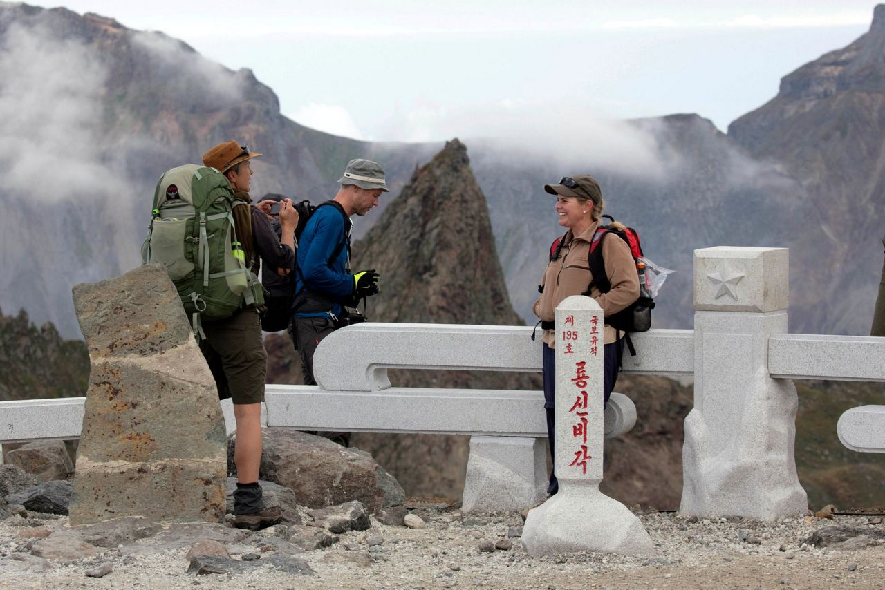 %headline(Tourists go off beaten path on North Korea's sacred volcano
