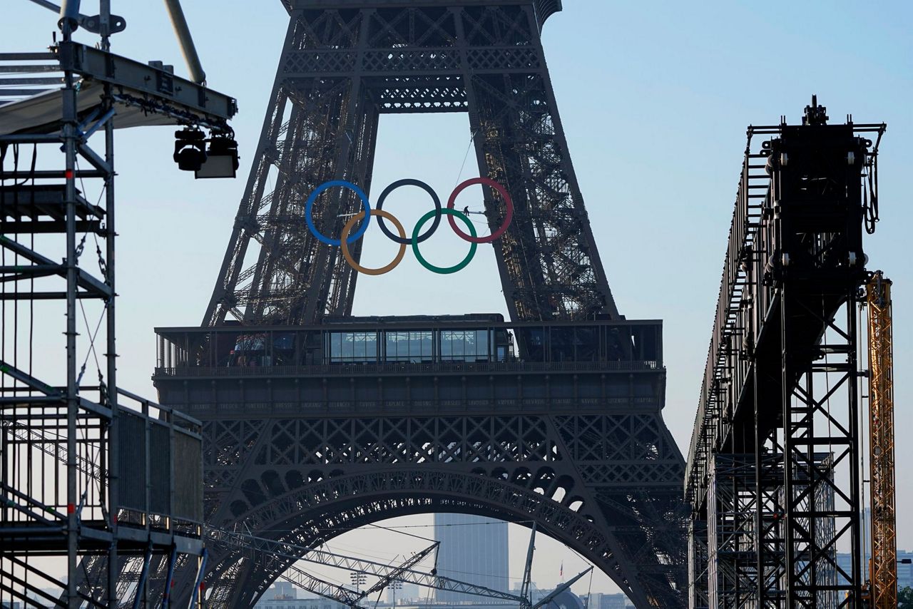 Paris Olympics organizers unveil a display of the five Olympic rings ...