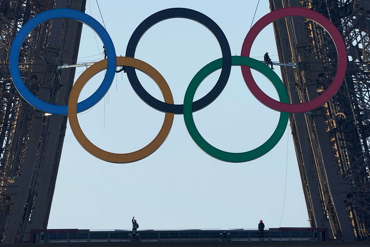 Paris Olympics organizers unveil a display of the five Olympic rings ...