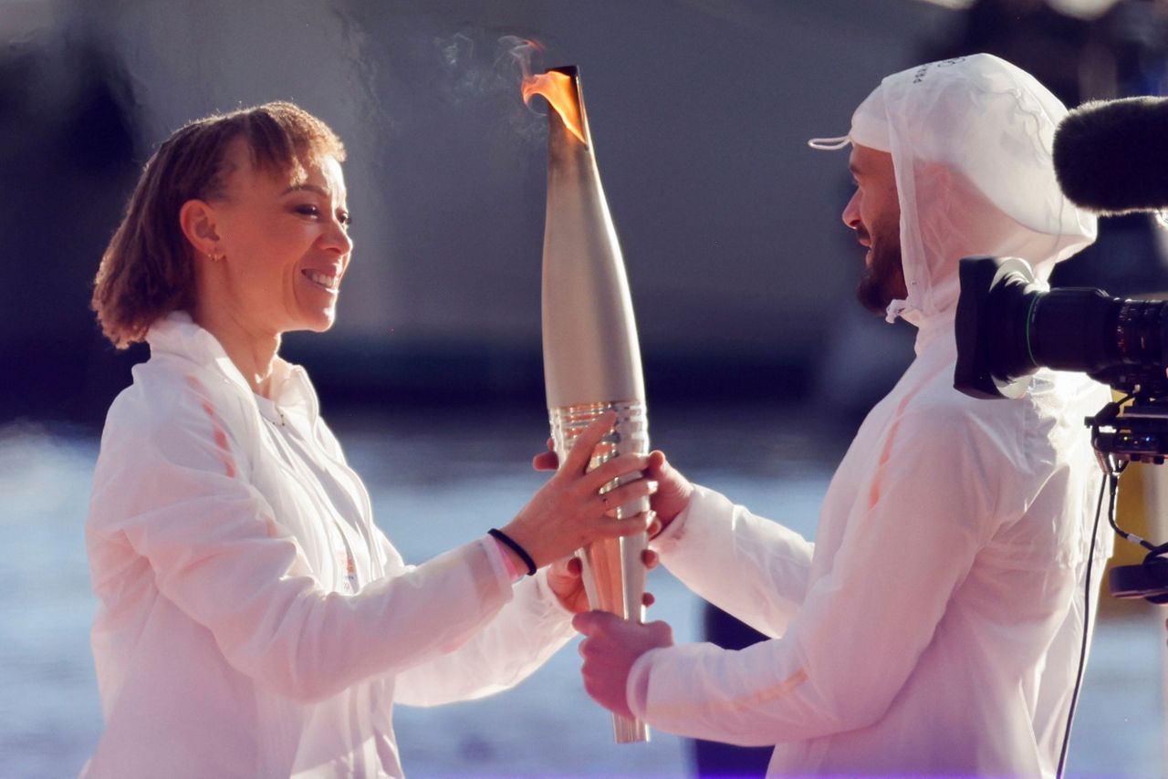 A ship carrying the Olympic torch arrives in Marseille amid fanfare and ...