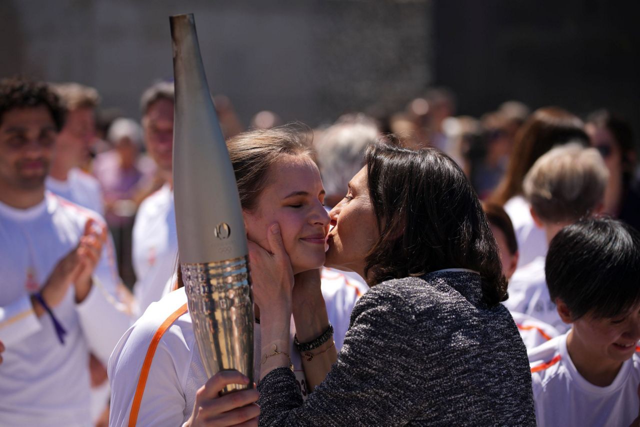 Torchbearers in Marseille kick off the Olympic flame's journey across ...