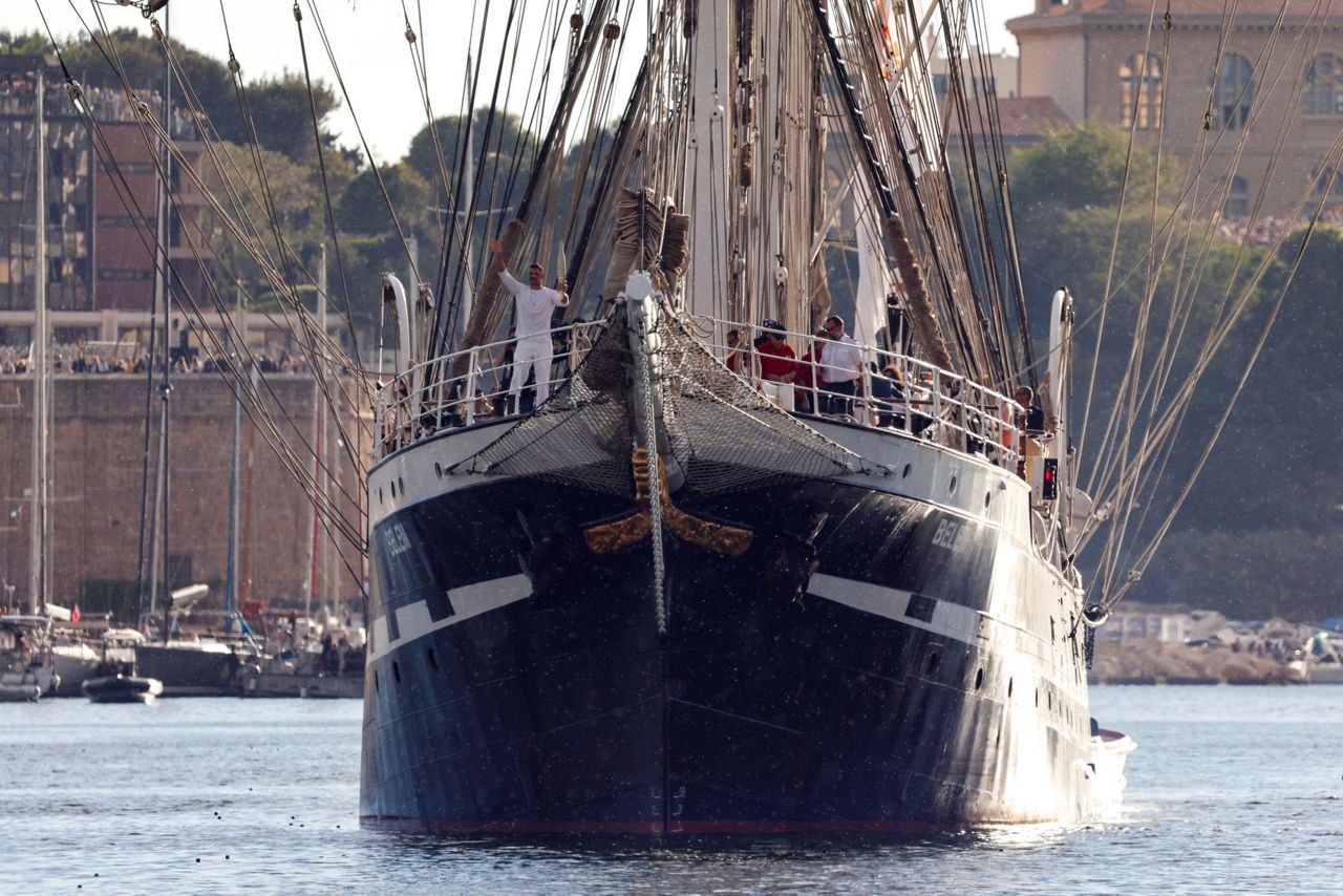 A ship carrying the Olympic torch arrives in Marseille amid fanfare and ...