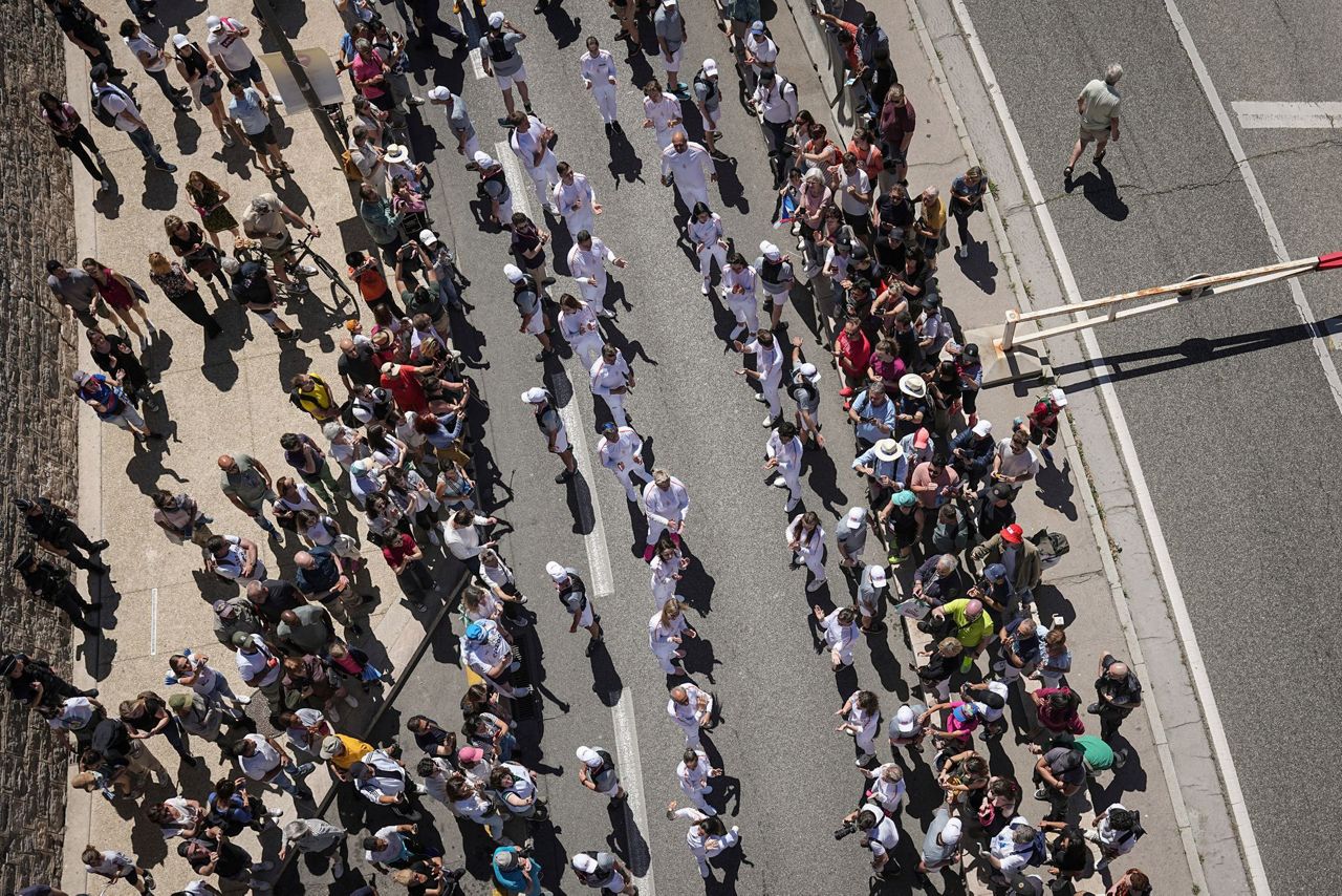 A Ukrainian gymnast carried the Paris Olympic torch with an EU team, in ...
