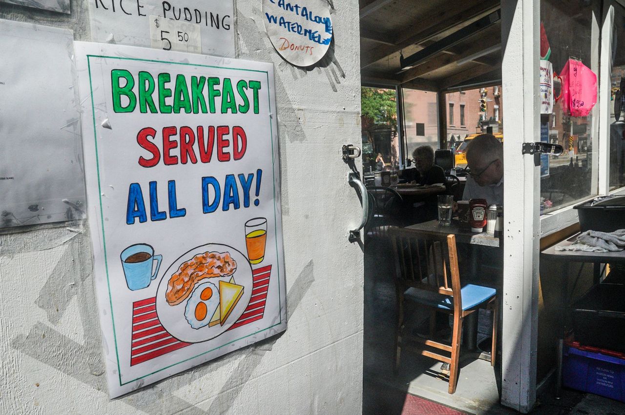 Octogenarian brothers make popular hand-drawn posters