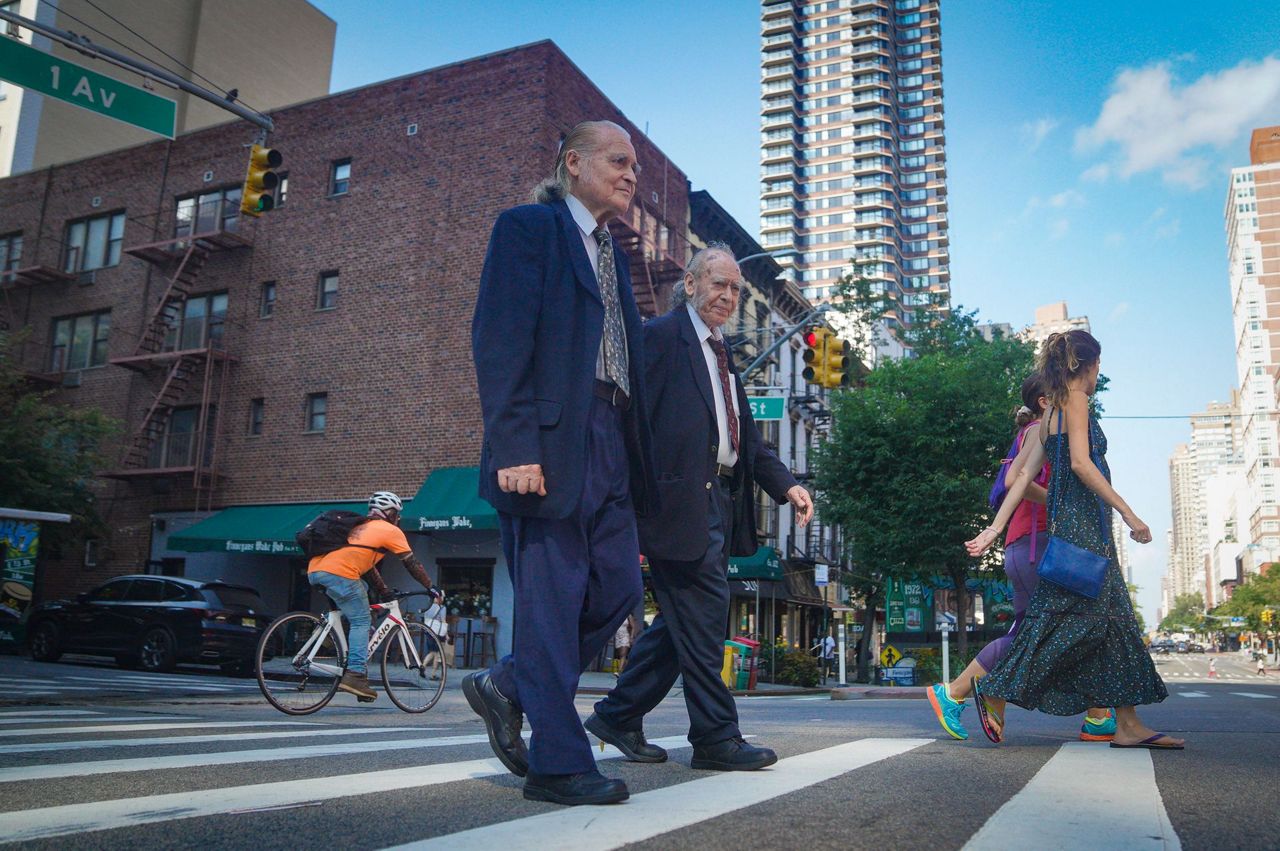 Octogenarian brothers make popular hand-drawn posters