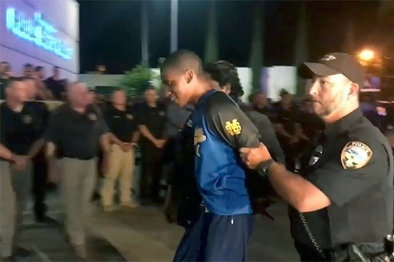 Mississippi police jail smiling suspect in officer's killing
