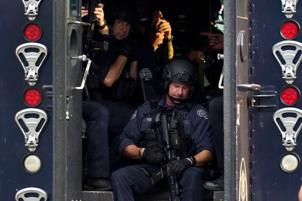 Gunman who shot 2 officers arrested after 12-hour standoff
