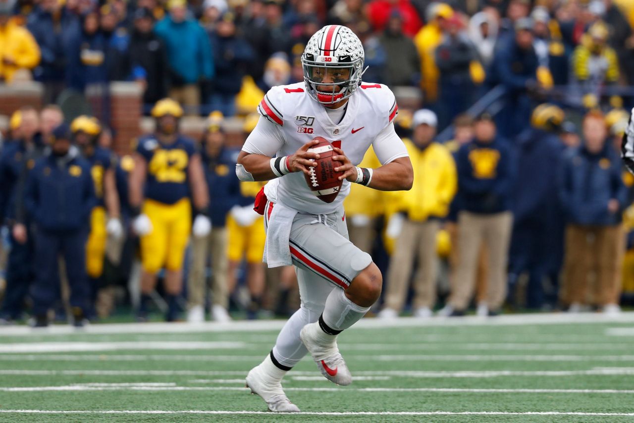 No. 2 Ohio State beats No. 10 Michigan 56-27 for record run