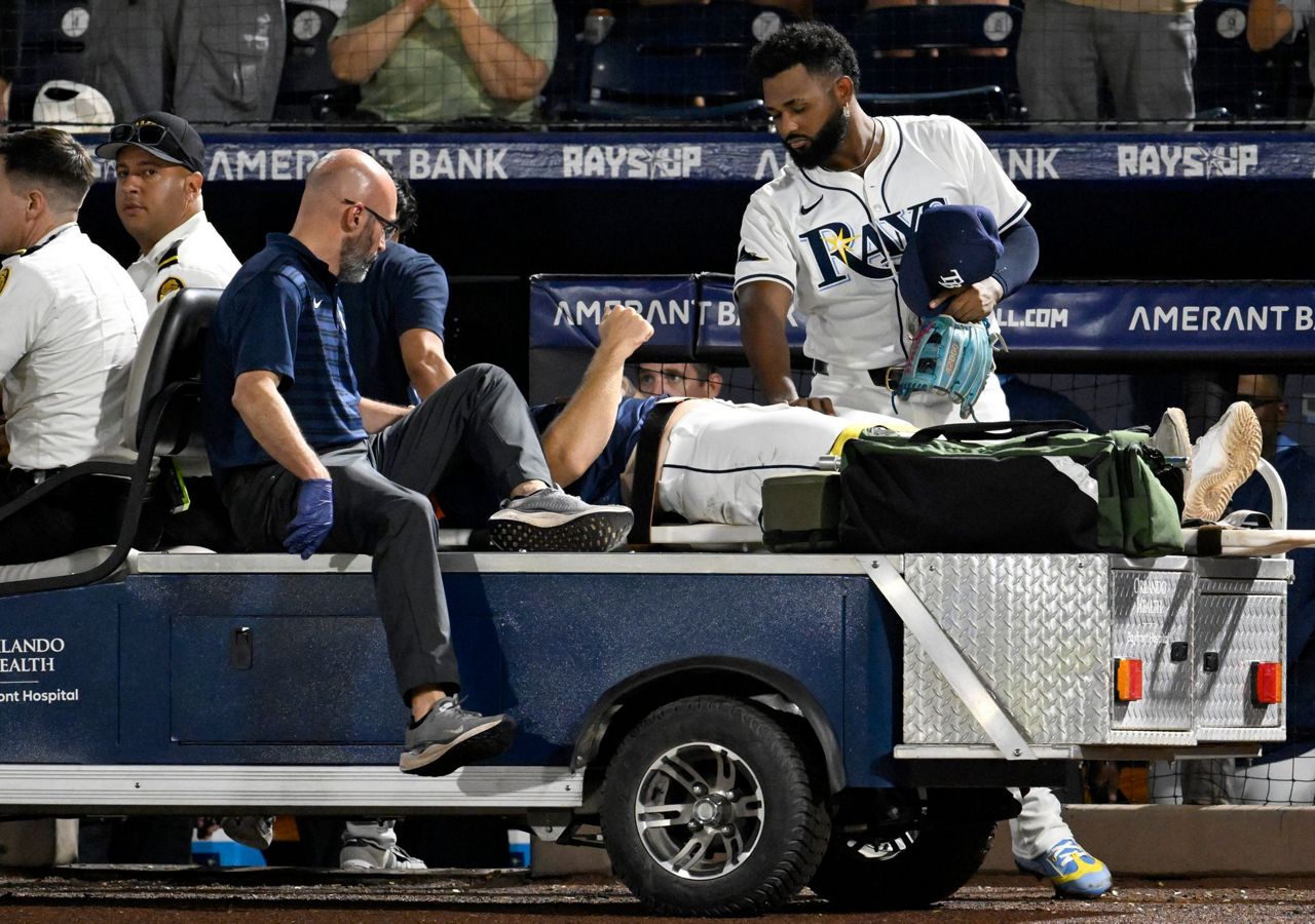 Rays pitcher carted off field after foul ball strikes him in dugout