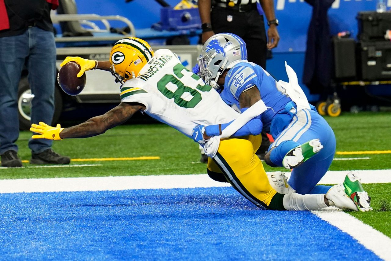 Rodgers-led Packers beat Lions 31-24, clinch NFC North title