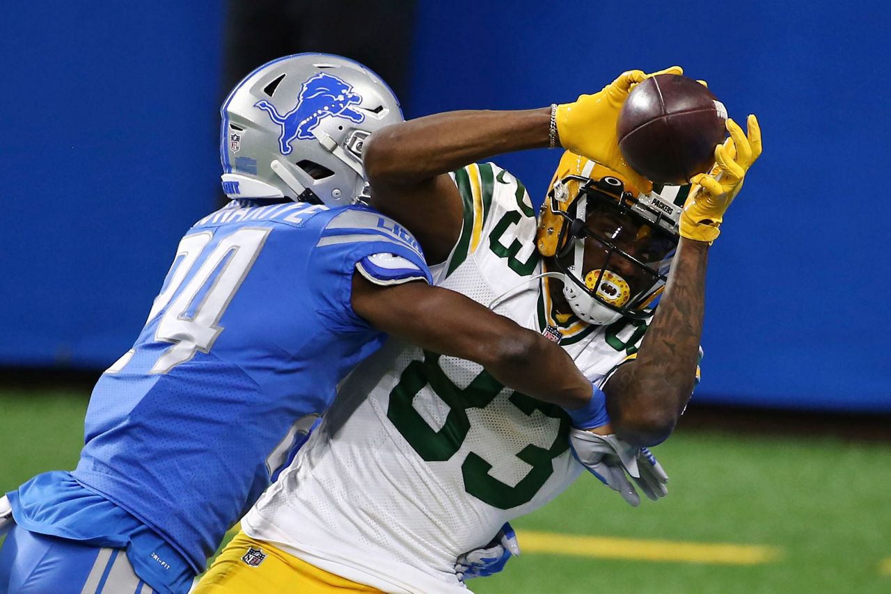 Rodgers-led Packers beat Lions 31-24, clinch NFC North title