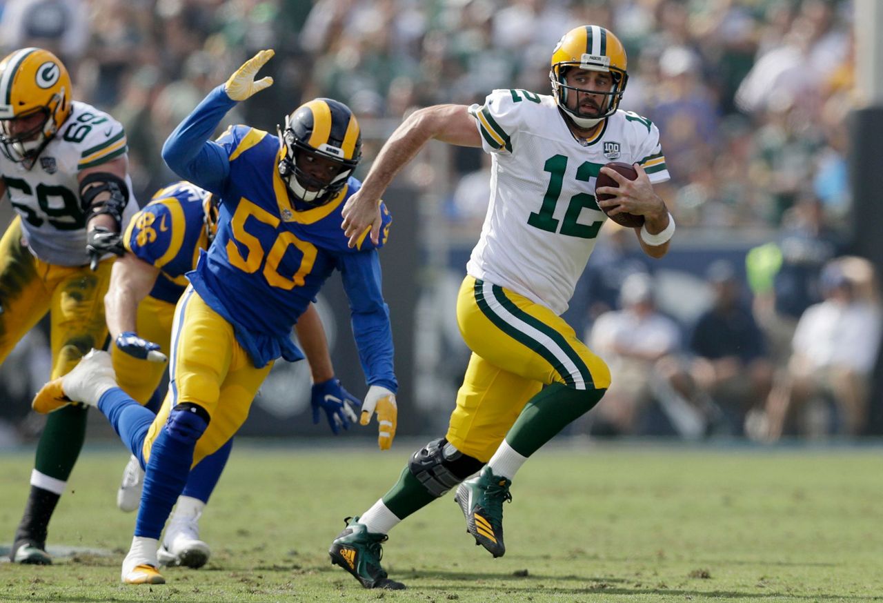 Wilson's big hit sends Rams to 8-0 with 29-27 win over Pack