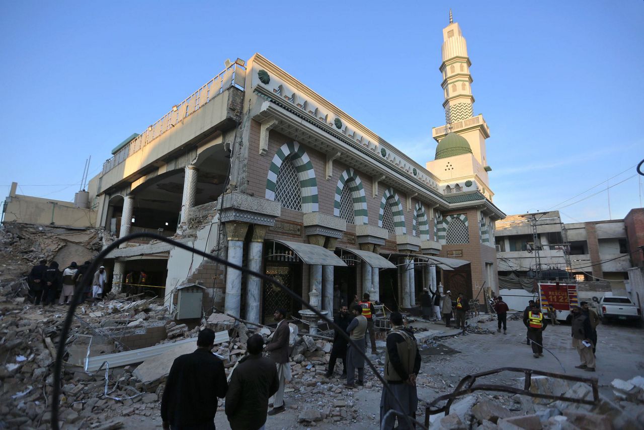 Militant who killed 101 at Pakistan mosque wore uniform