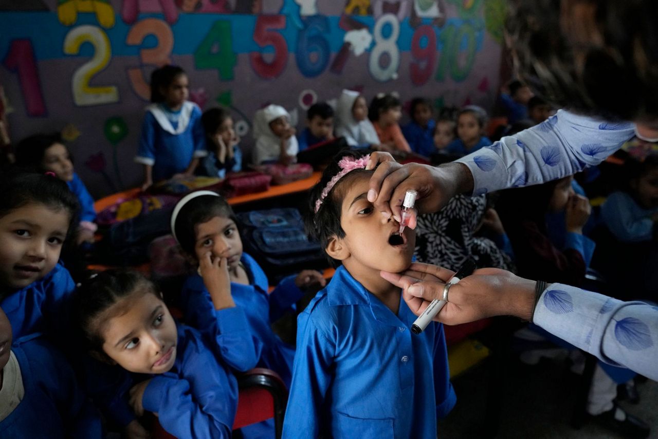 Pakistan says gunmen killed policeman guarding polio workers