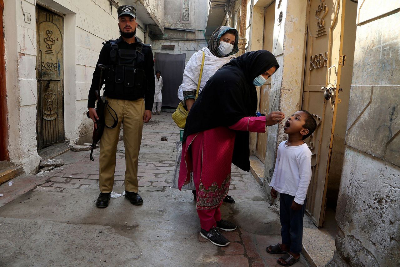 Pakistan says gunmen killed policeman guarding polio workers