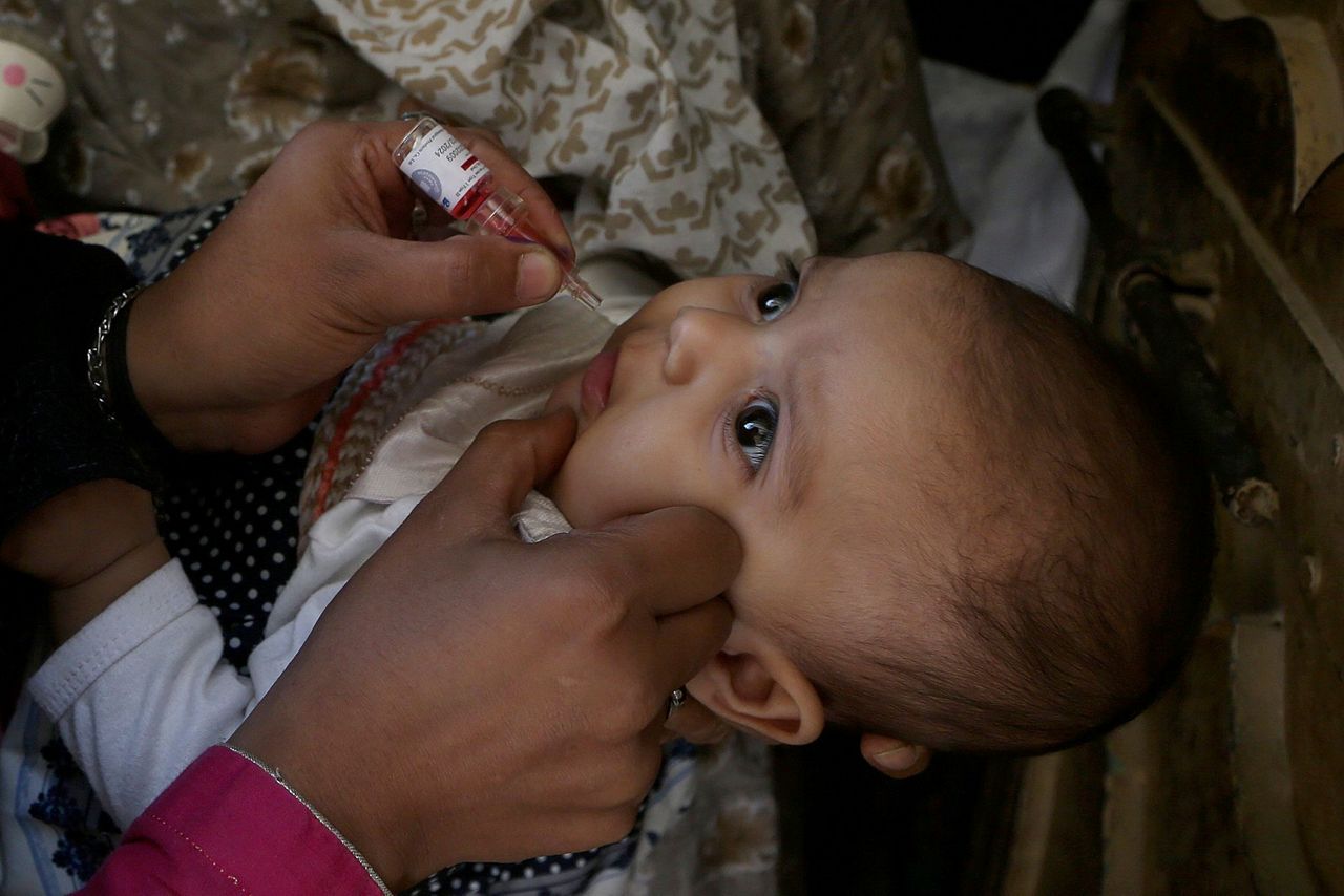 Pakistan says gunmen killed policeman guarding polio workers