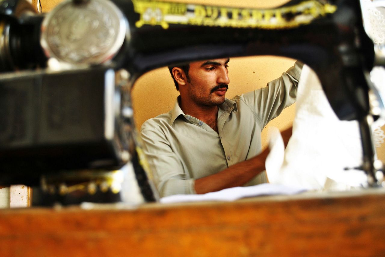 AP PHOTOS: Inside the changing world of a Pakistani tailor