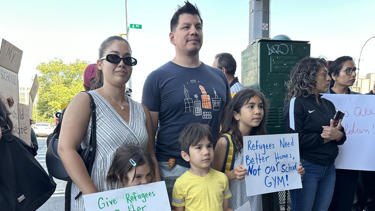 Parents rally against housing of migrants in school gym