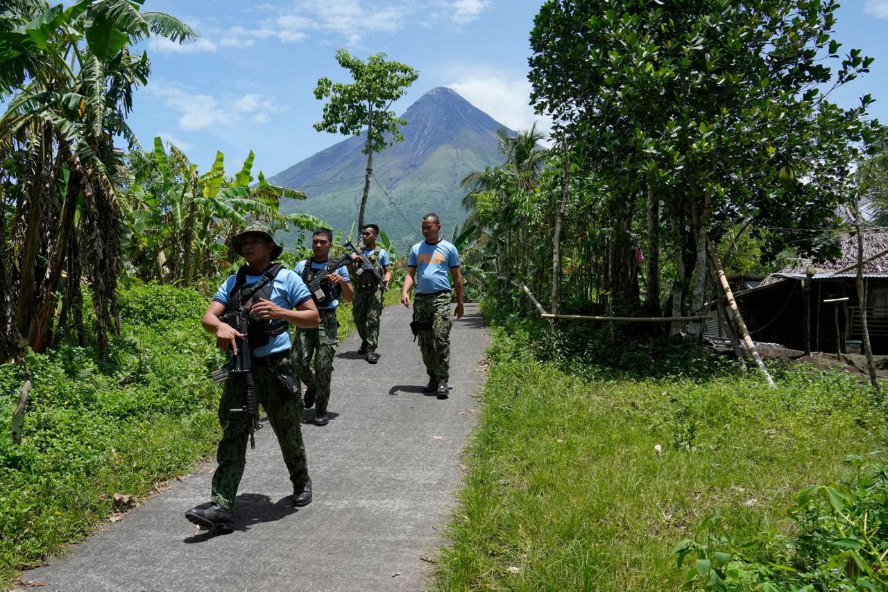 Students meet under trees as schools shelter villagers displaced by ...