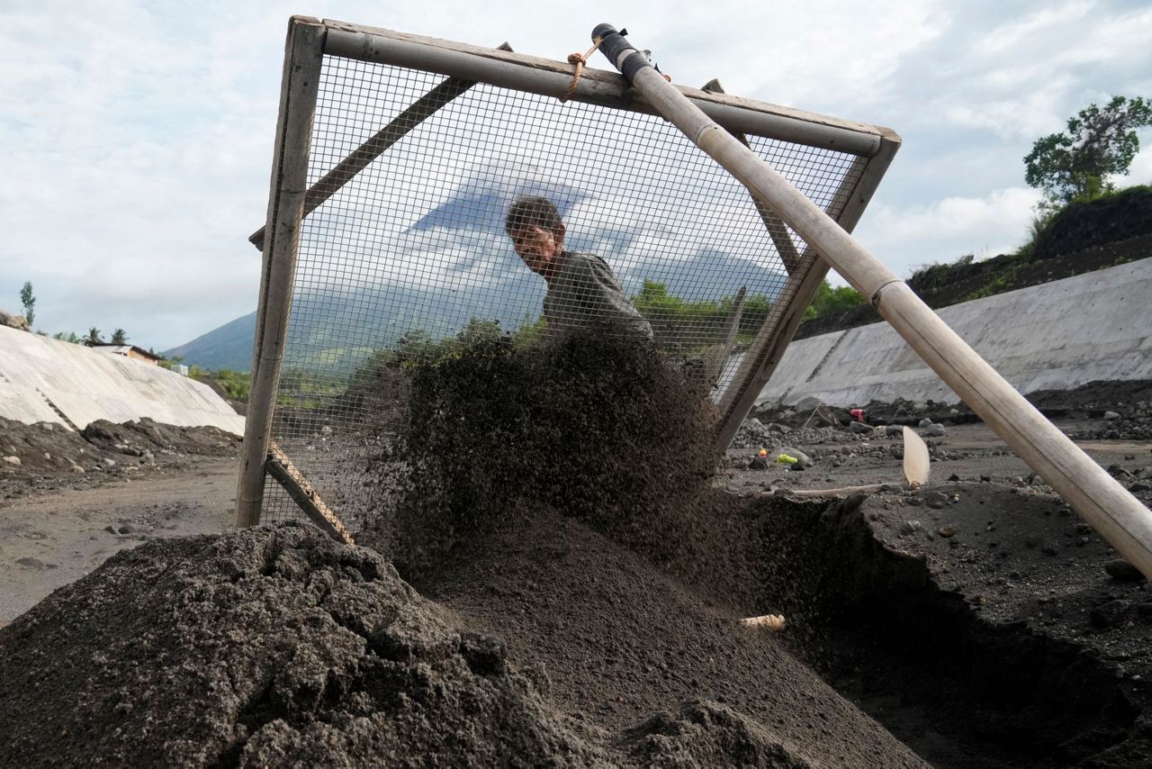 Philippines' Mayon Volcano spews lava down its slopes in gentle ...