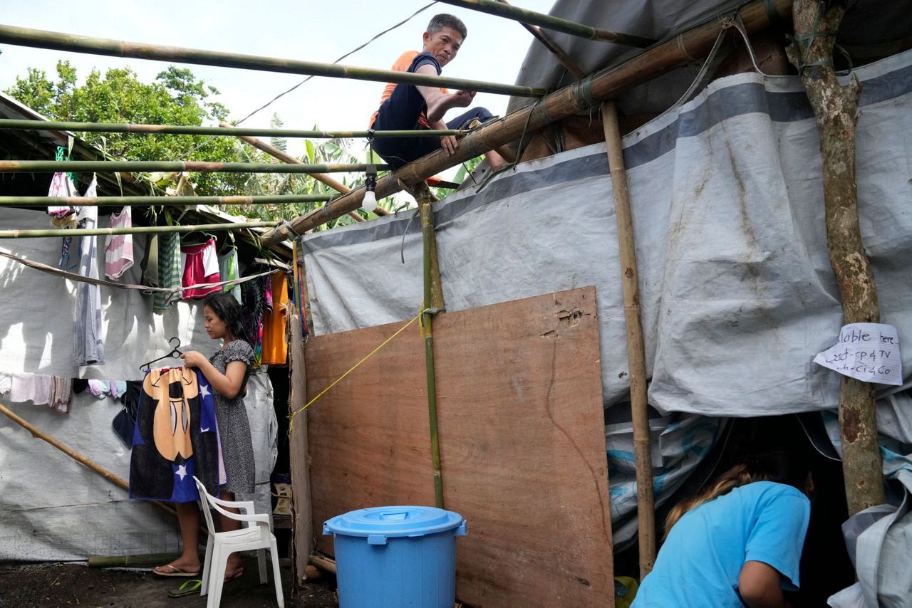 Students meet under trees as schools shelter villagers displaced by ...