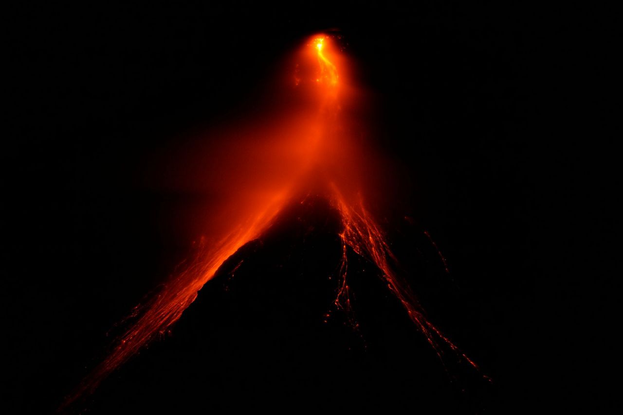 Philippines' Mayon Volcano spews lava down its slopes in gentle ...