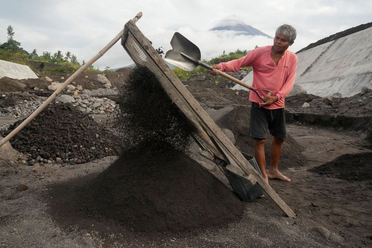 Philippines' Mayon Volcano spews lava down its slopes in gentle ...