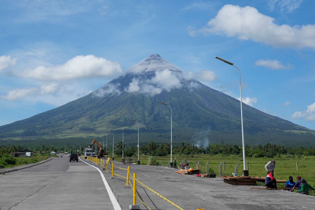 Philippines' Mayon Volcano spews lava down its slopes in gentle ...