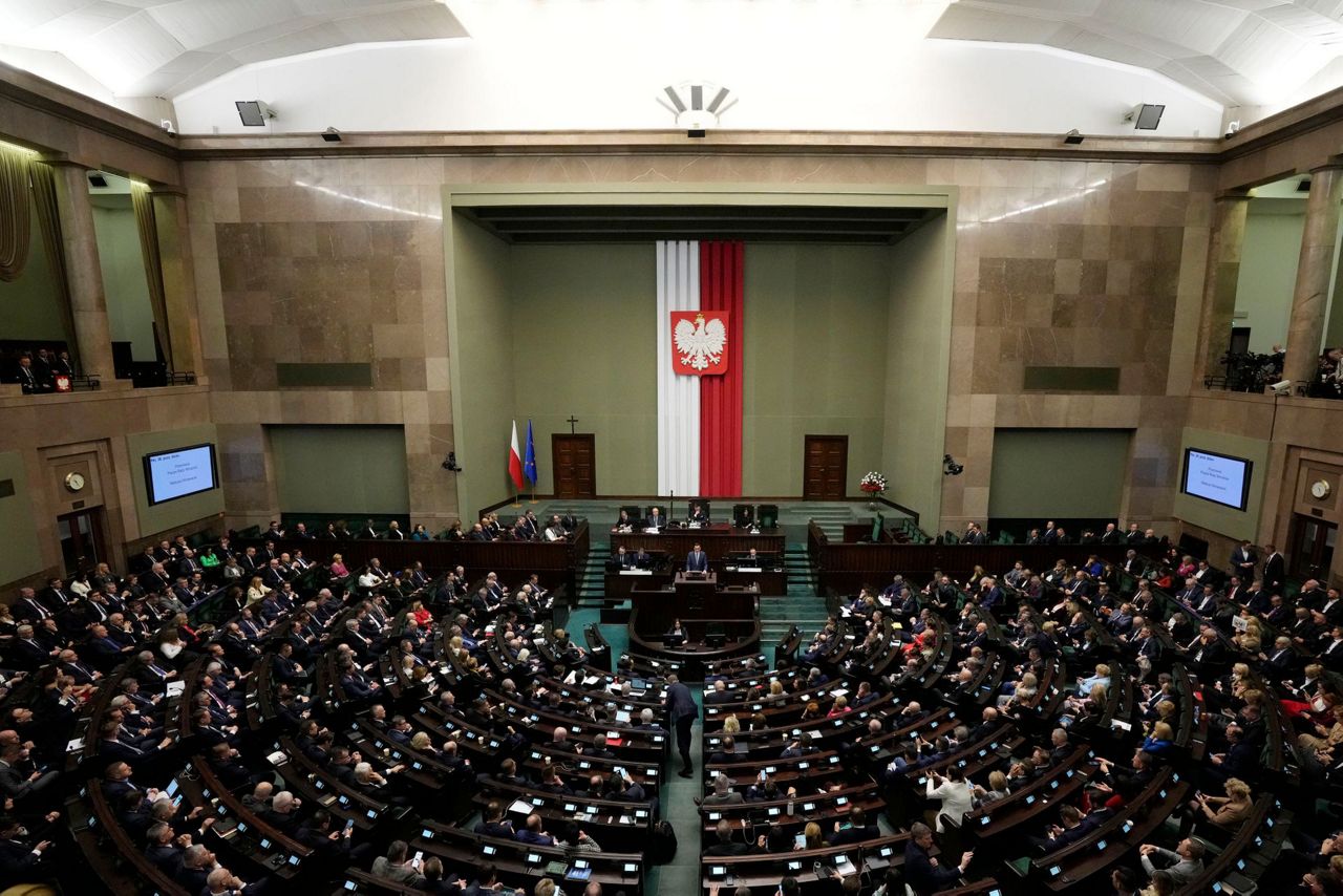 A day of 2 prime ministers in Poland begins the delayed transition to a ...