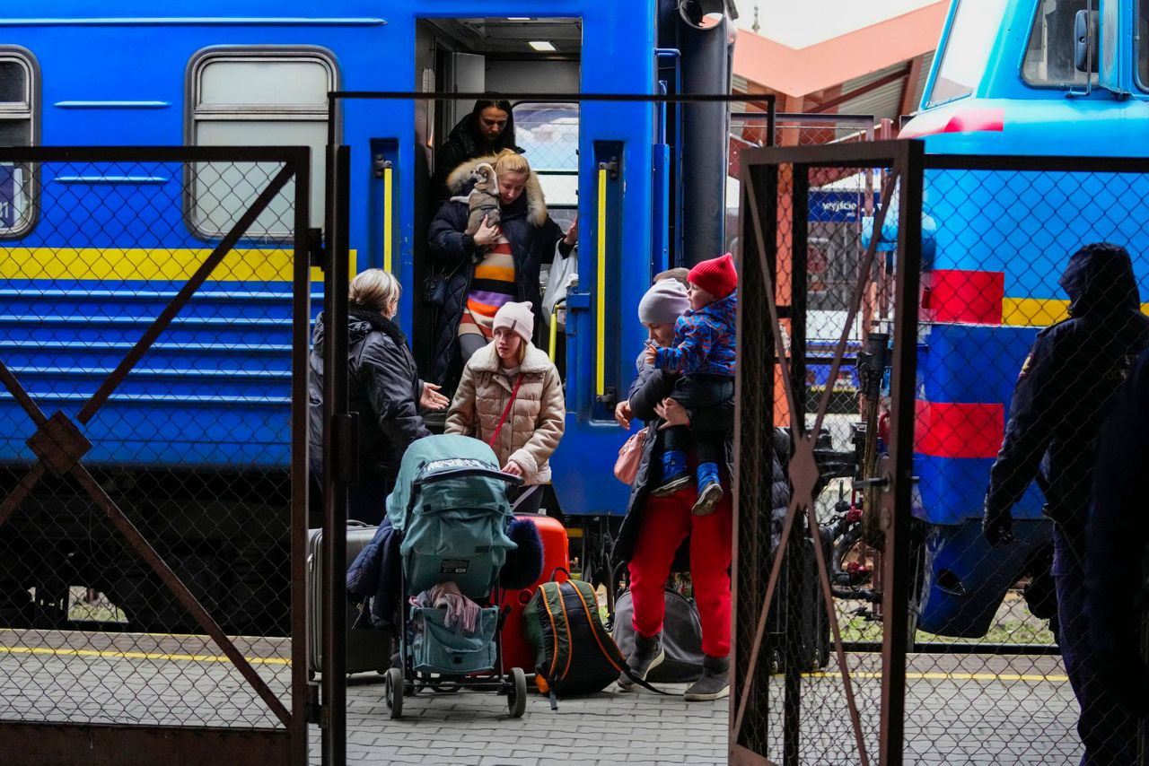 Ukrainians flee war, seeking safety across western borders