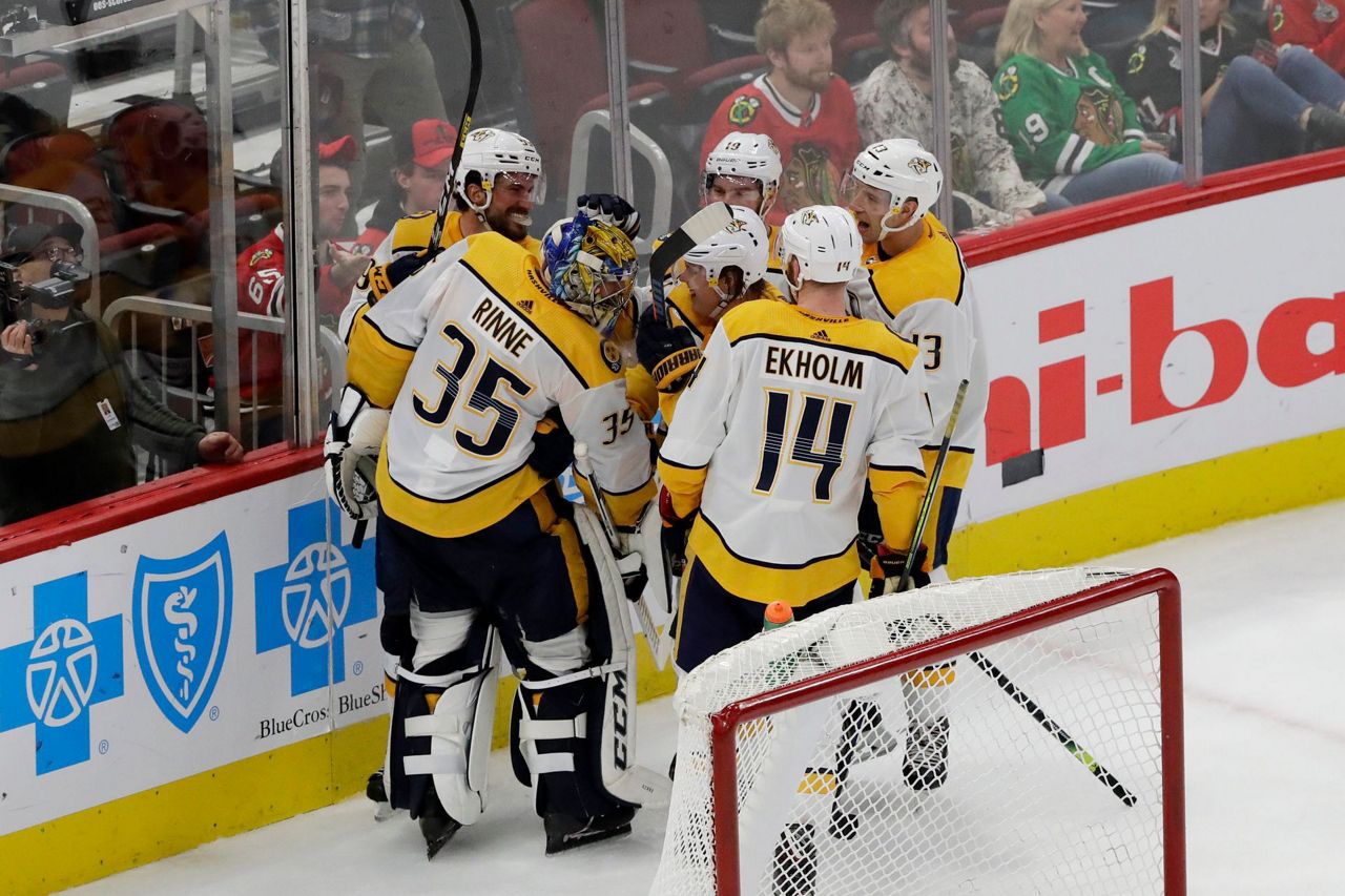 Predators beat Blackhawks 5-2 for Hynes' 1st win with team