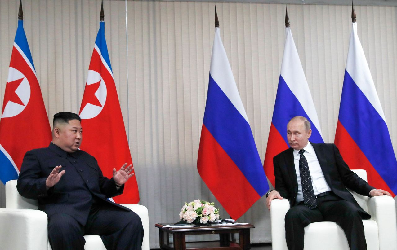 At Kim-Putin summit, hearty handshakes and manspreading