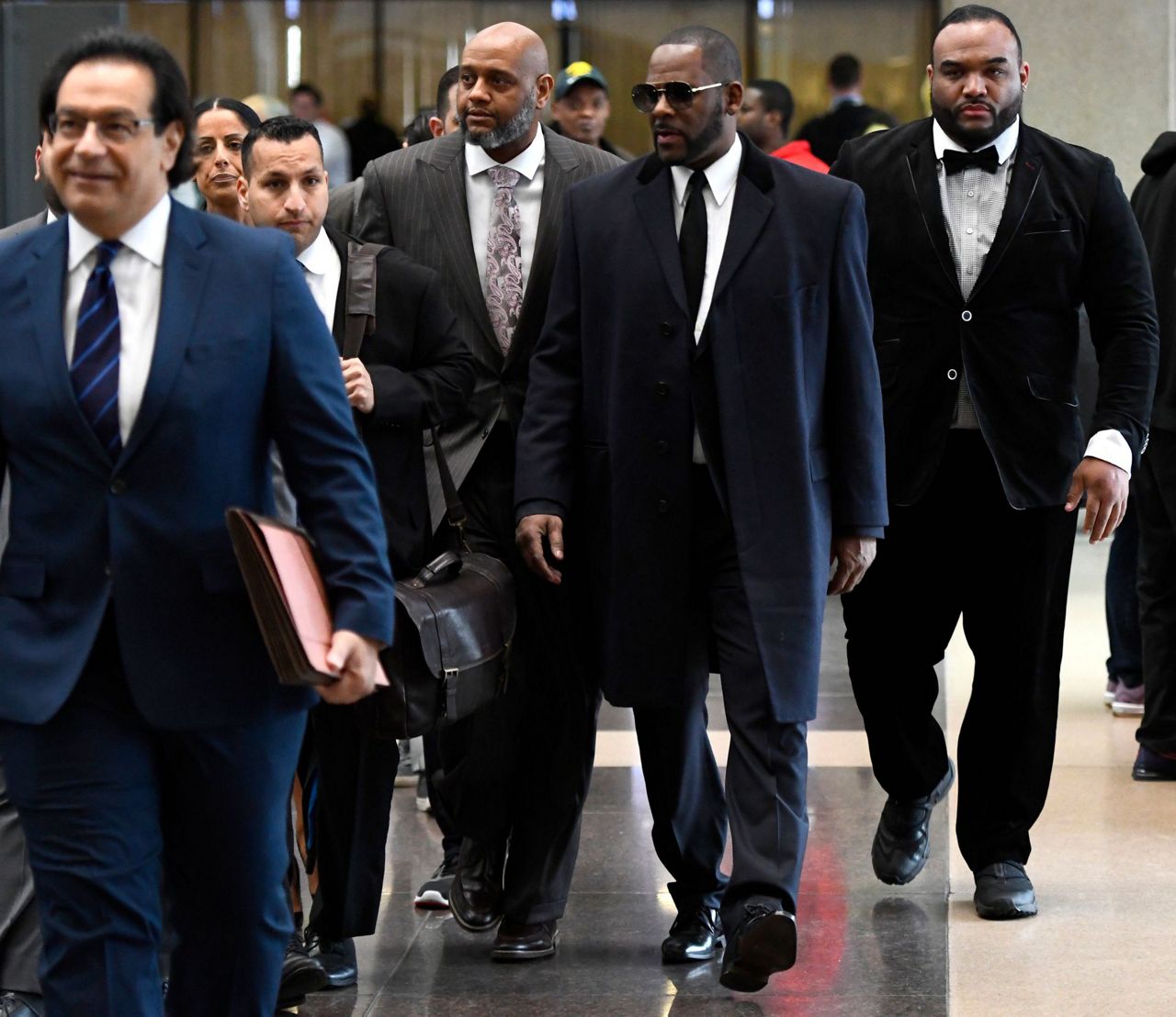 The Latest: R. Kelly back at hearing in sexual abuse case