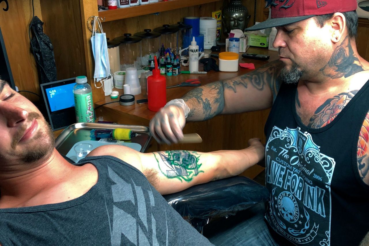 Tattoo artist sees bump in desire to erase hateful skin art