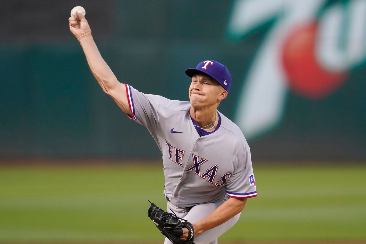 Otto outpitches former high school teammate, Texas tops A's
