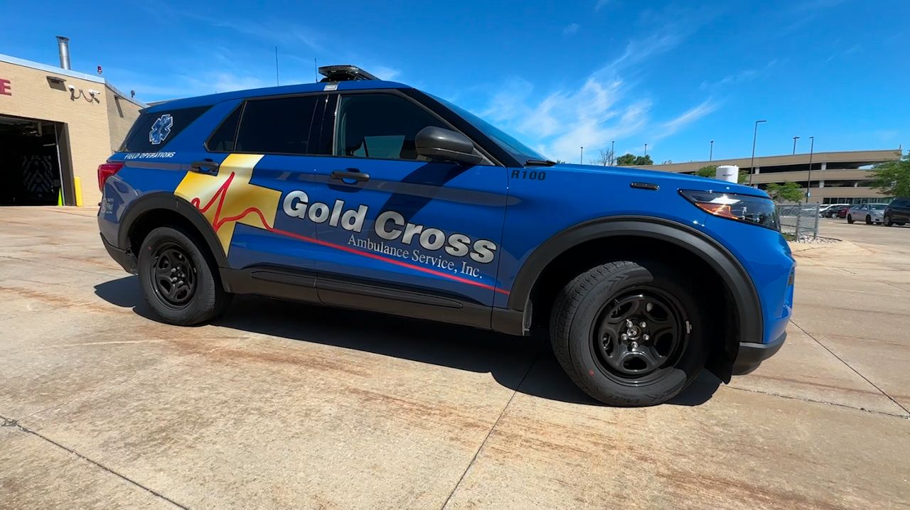 Gold Cross rapid response vehicle helping ambulance crews