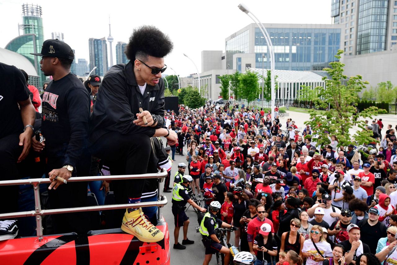Huge crowds pack downtown Toronto for Raptors parade