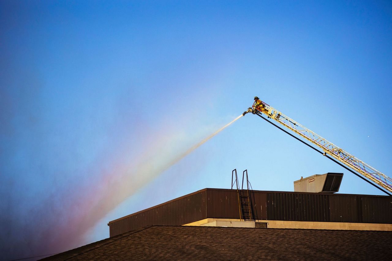 Crews battle flames, cold, wind in huge recycling plant fire