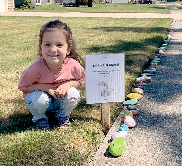 Sidewalk snake becomes a growing gallery of memories