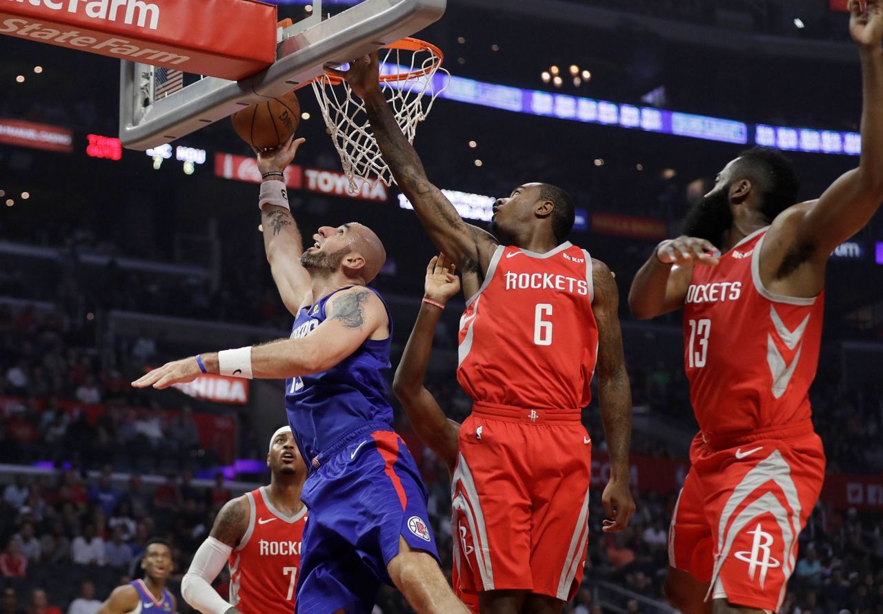 Led by bench, Clippers hang on to beat Rockets 115-112