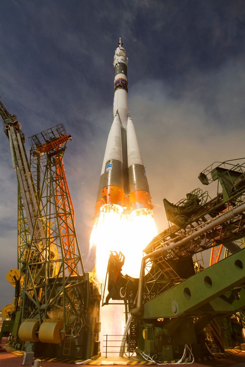 Soyuz capsule with 3 astronauts docks with space station