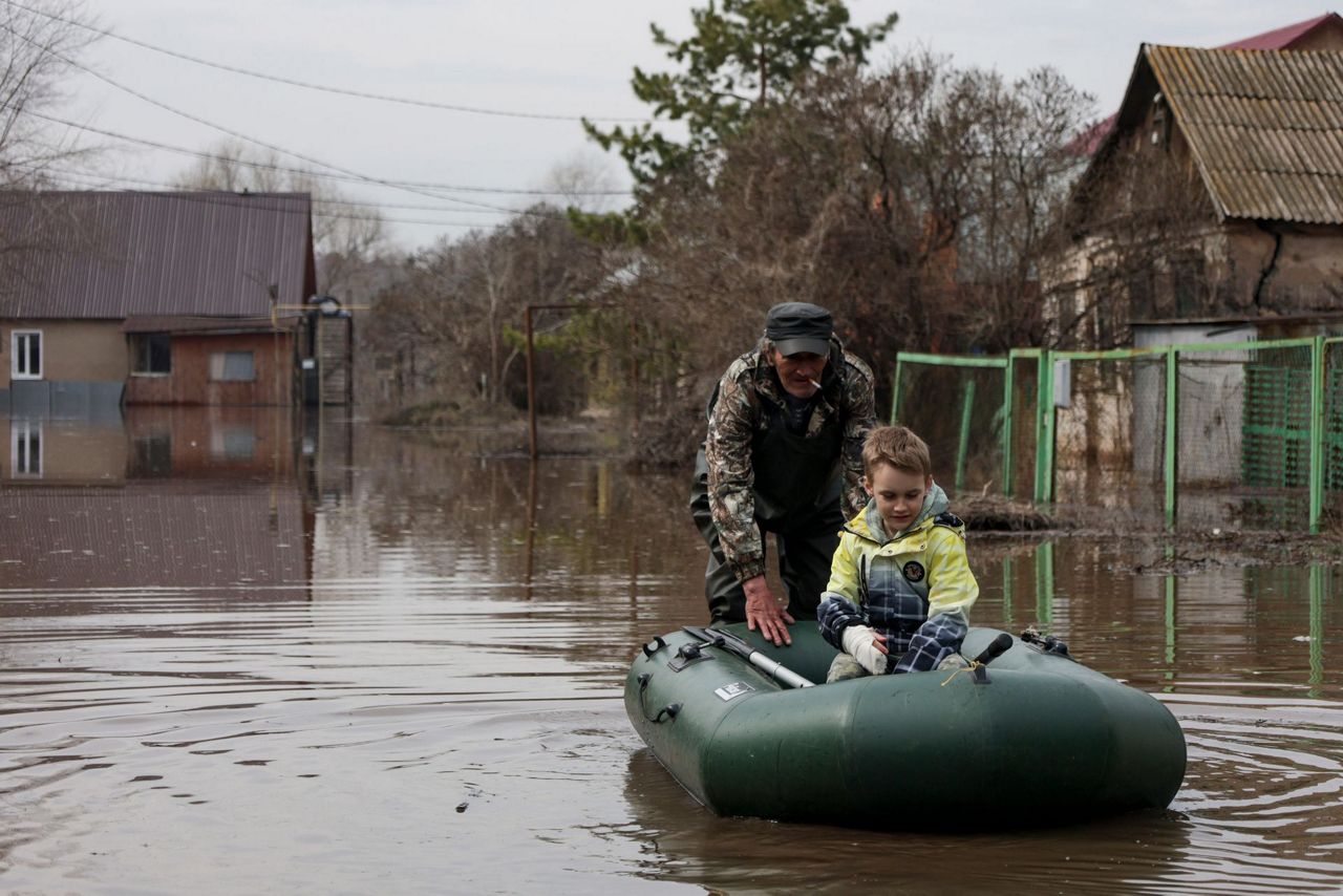 Water levels rise and homes flood in Russia after a dam bursts near the ...