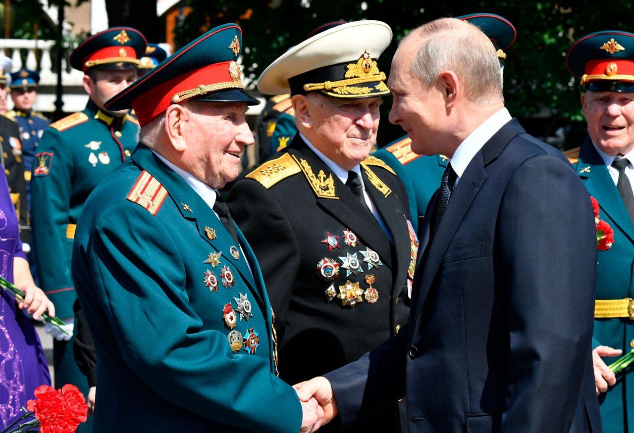 Putin hails WW II heroes, warns of degrading Europe security