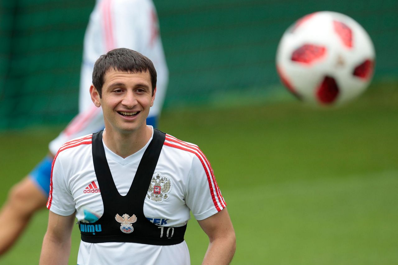 The Latest: Russia midfielder Dzagoev fit for Croatia game